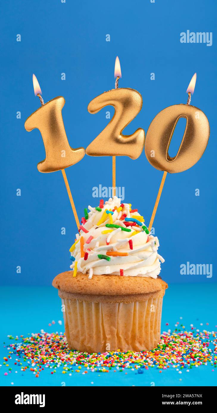 Birthday cake with candle number 120 - Blue background Stock Photo - Alamy