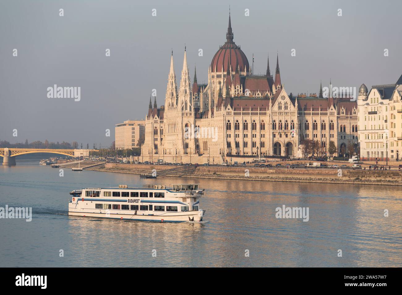 Hungary, Budapest, tourist boat along the Danube with the parliament ...