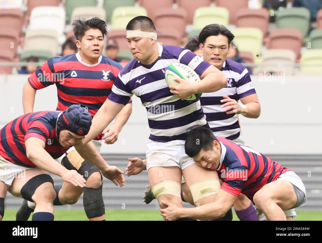 Tokyo, Japan. 2nd Jan, 2024. Meiji University lock Daichi Sato carries the ball during the semi ...