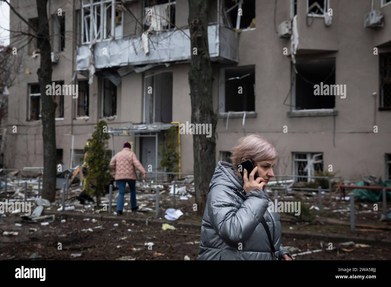 people standing in front of their homes that were targeted by a rocket ...