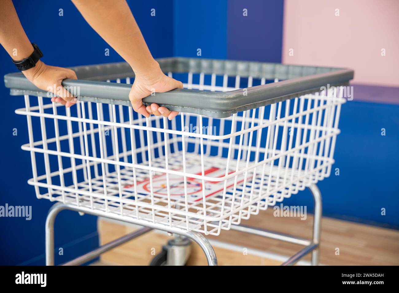 Woman hands holding empty new white trolley cart Stock Photo - Alamy