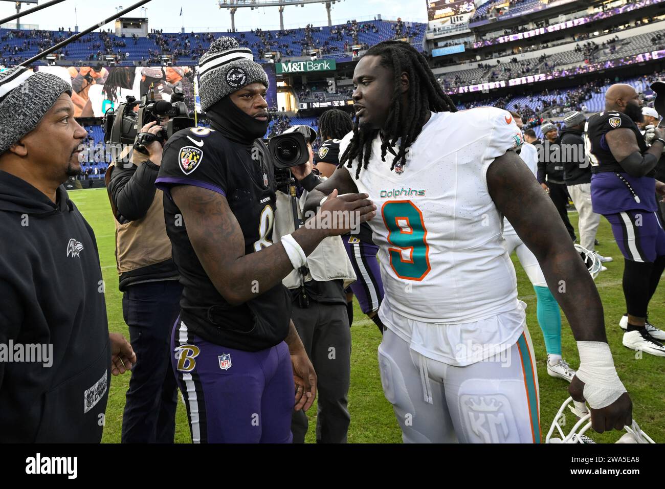 Baltimore Ravens quarterback Lamar Jackson (8) is greeted by Miami ...
