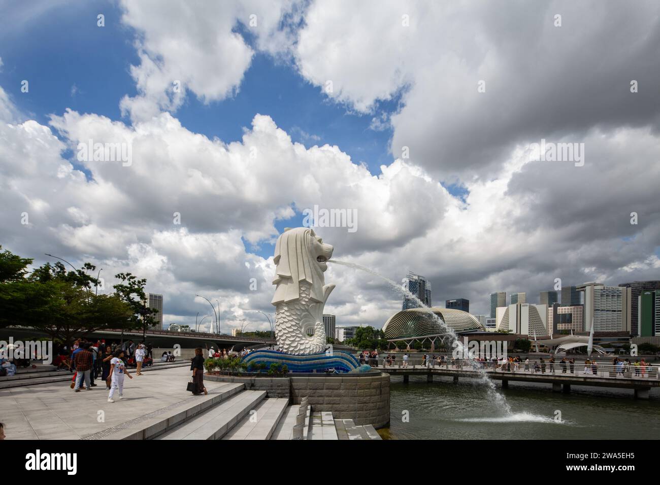 Merlion sprouting water under the dramatic cloud formation, Singapore ...