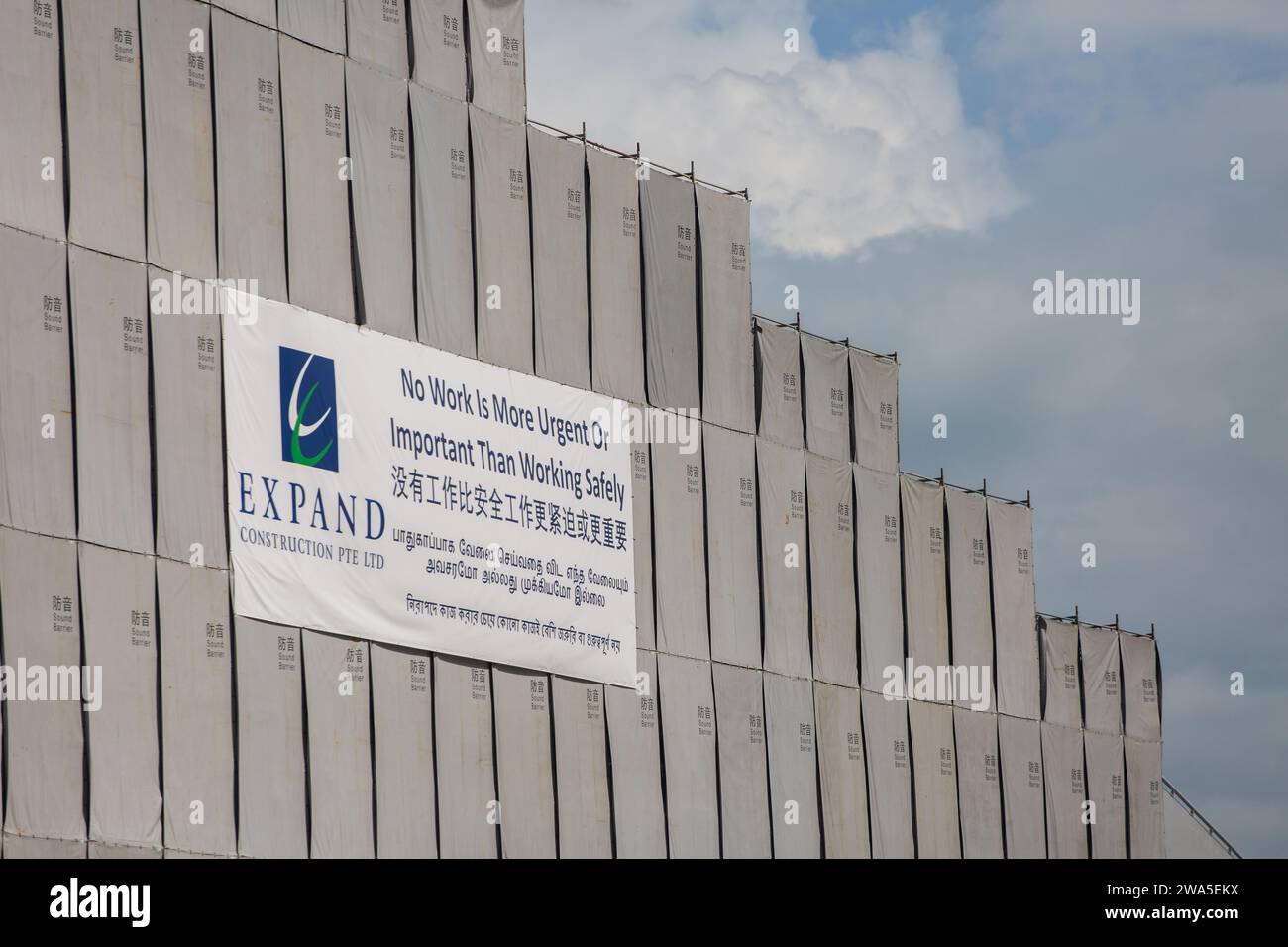 A demolition company display safety banner on the sound barrier ...