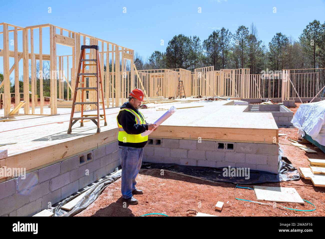 Construction inspector used blueprints to verify quality of work being ...