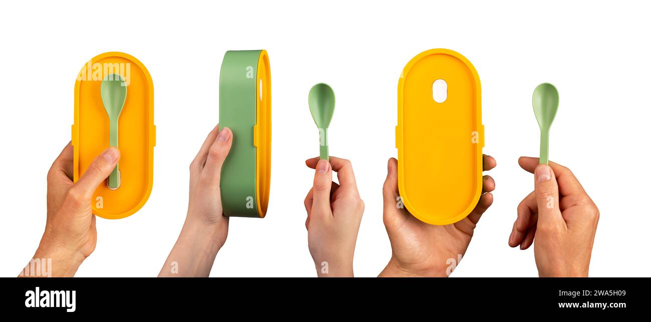 Hands holding lunch boxes and plastic spoon. Lunchbox, eco food ...
