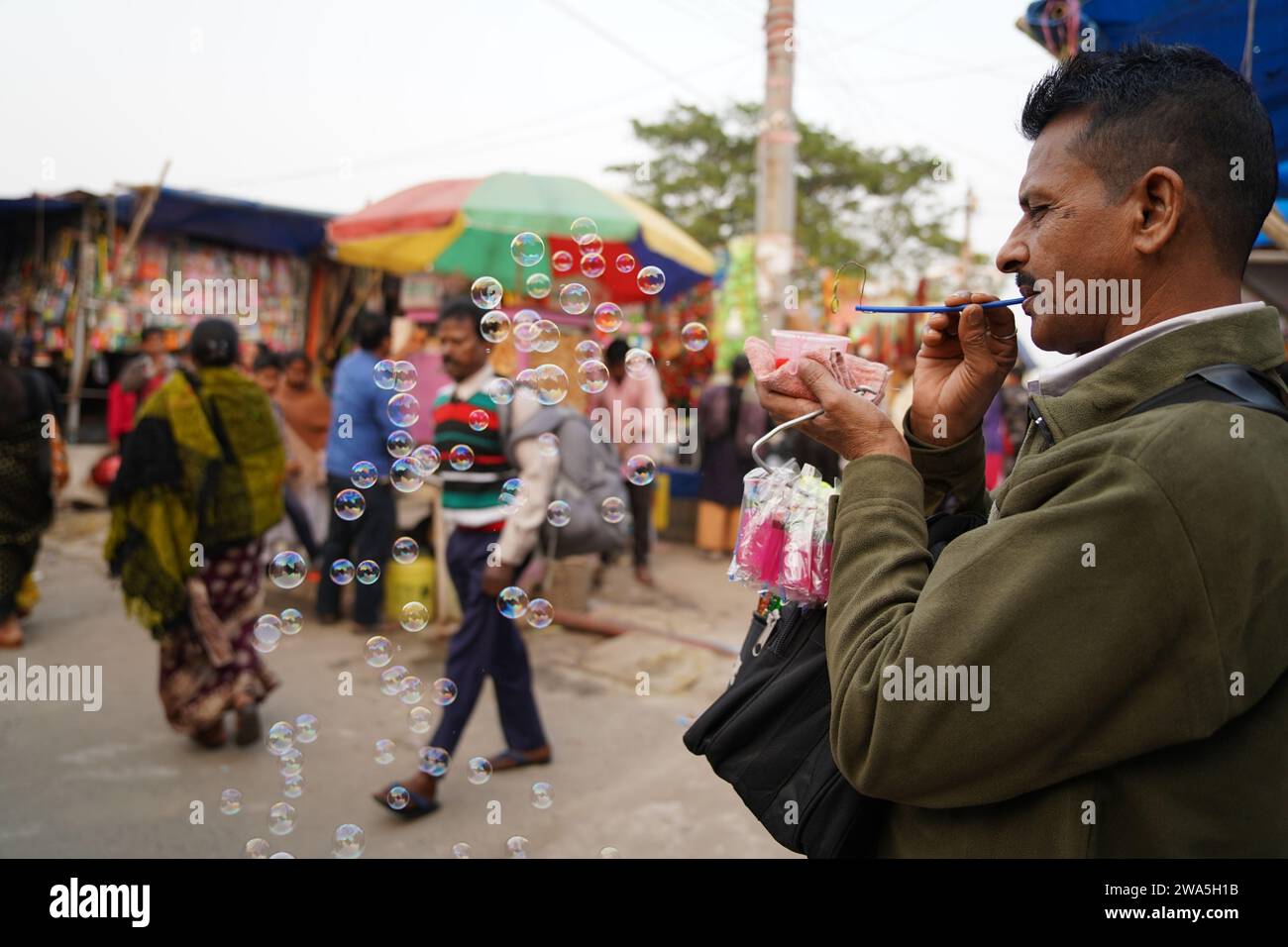 Uluberia, West Bengal, India. 30th Dec, 2023. Along the glimmering ...