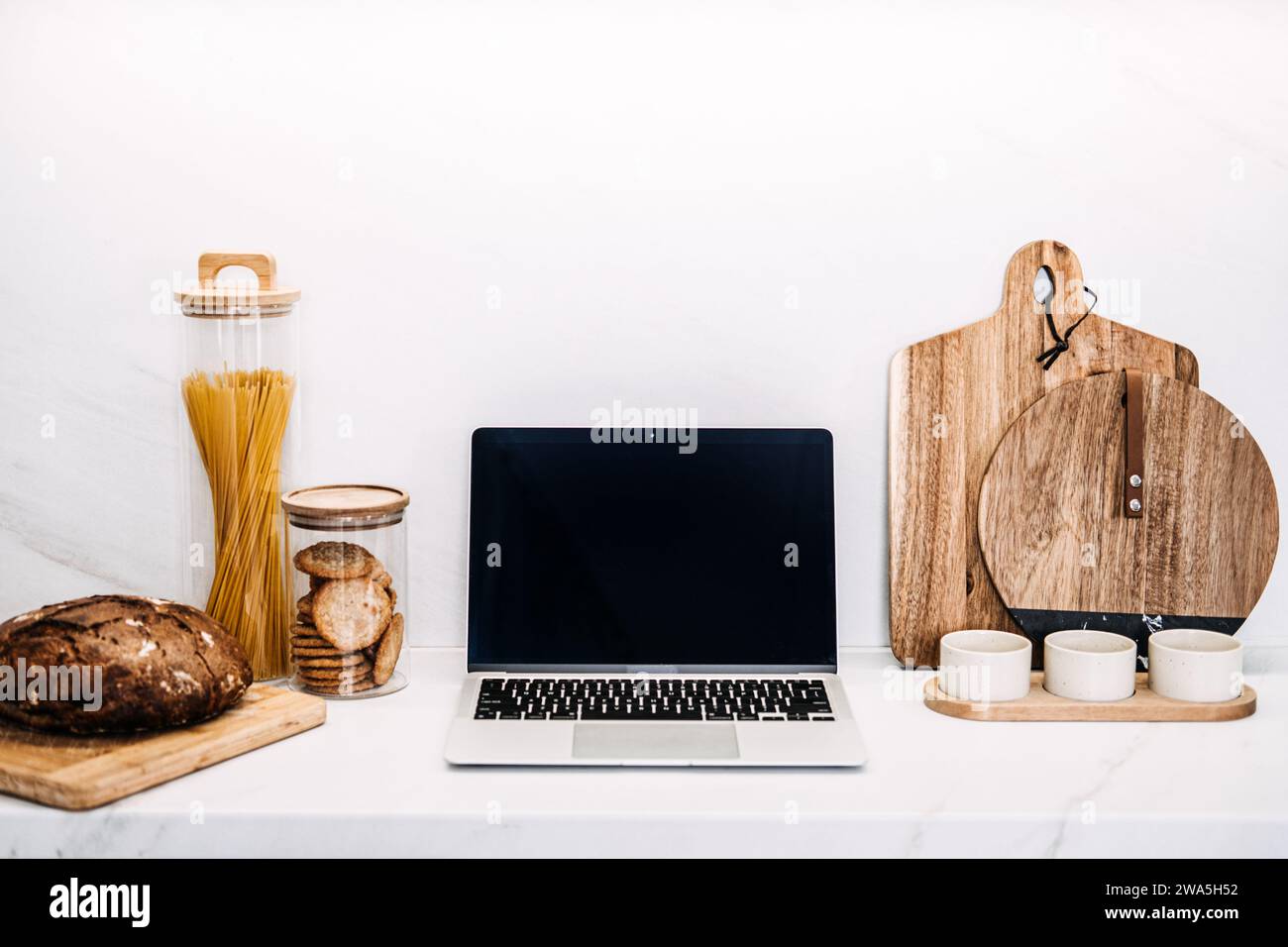 Modern Mockup empty Laptop on Kitchen Counter with Artisanal Decor ...