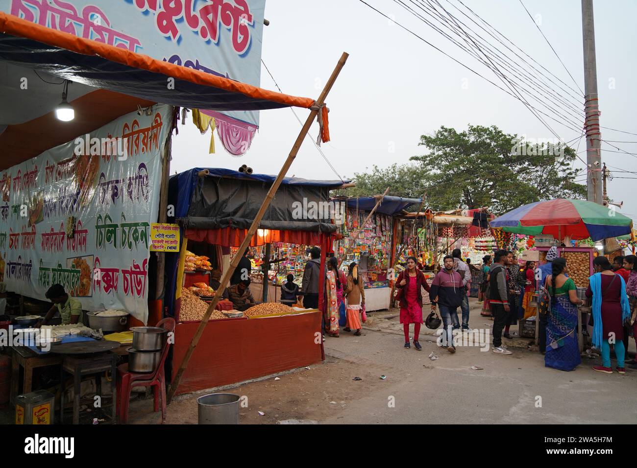Uluberia, West Bengal, India. 30th Dec, 2023. Along the glimmering ...