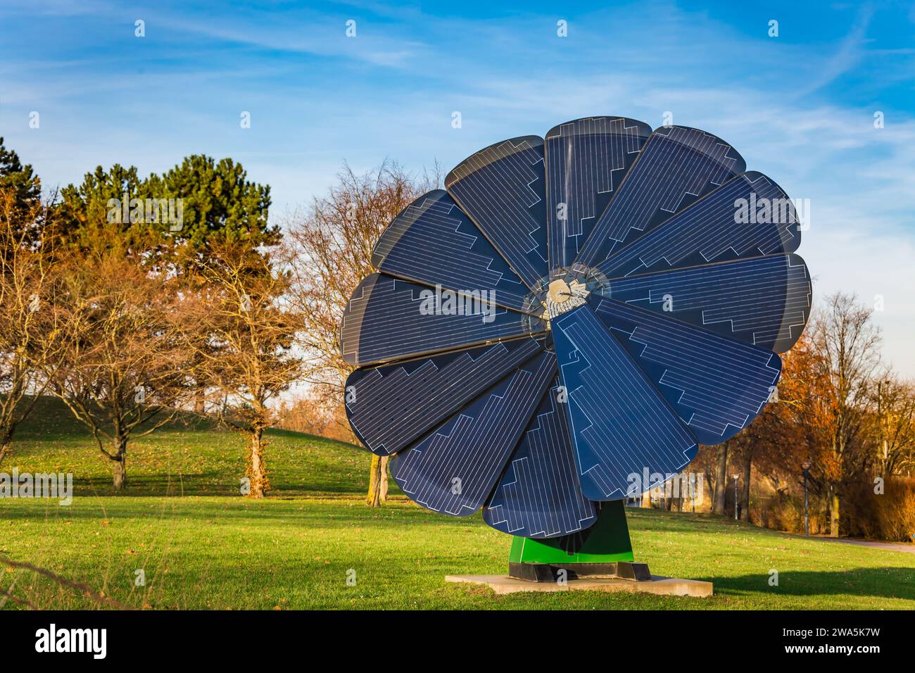 Rotating solar panel in flower shape in a city park. Photovoltaic ...