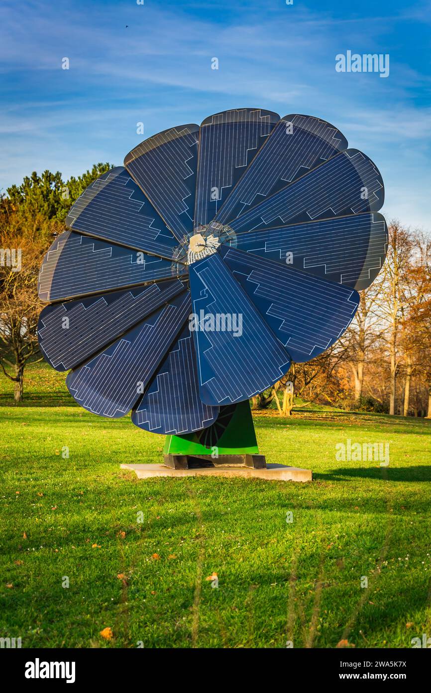 Rotating solar panel in flower shape in a city park. Photovoltaic ...