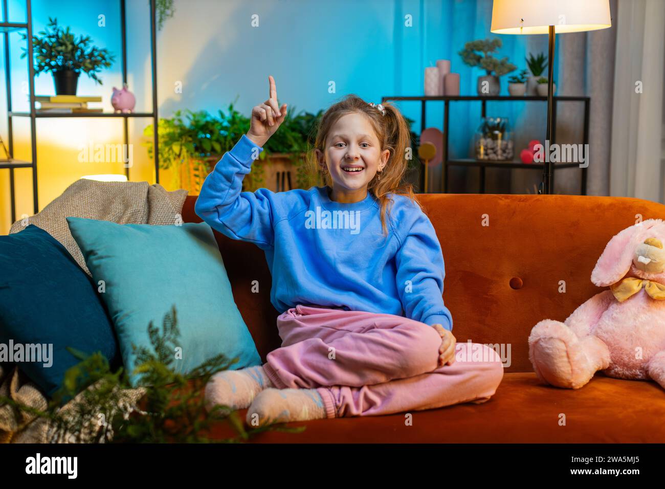 Eureka. Thoughtful clever inspired child girl make gesture raises ...