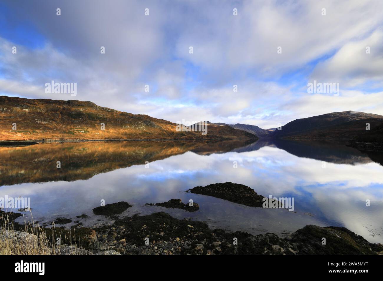 Mountain reflections in Loch Gleann Dubh, Kylesku village, Sutherland ...