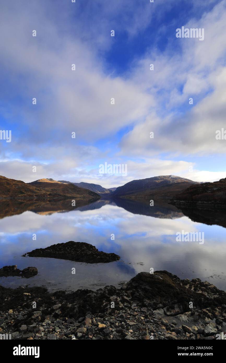 Mountain reflections in Loch Gleann Dubh, Kylesku village, Sutherland ...