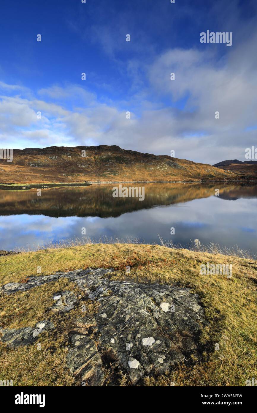 Mountain reflections in Loch Gleann Dubh, Kylesku village, Sutherland ...