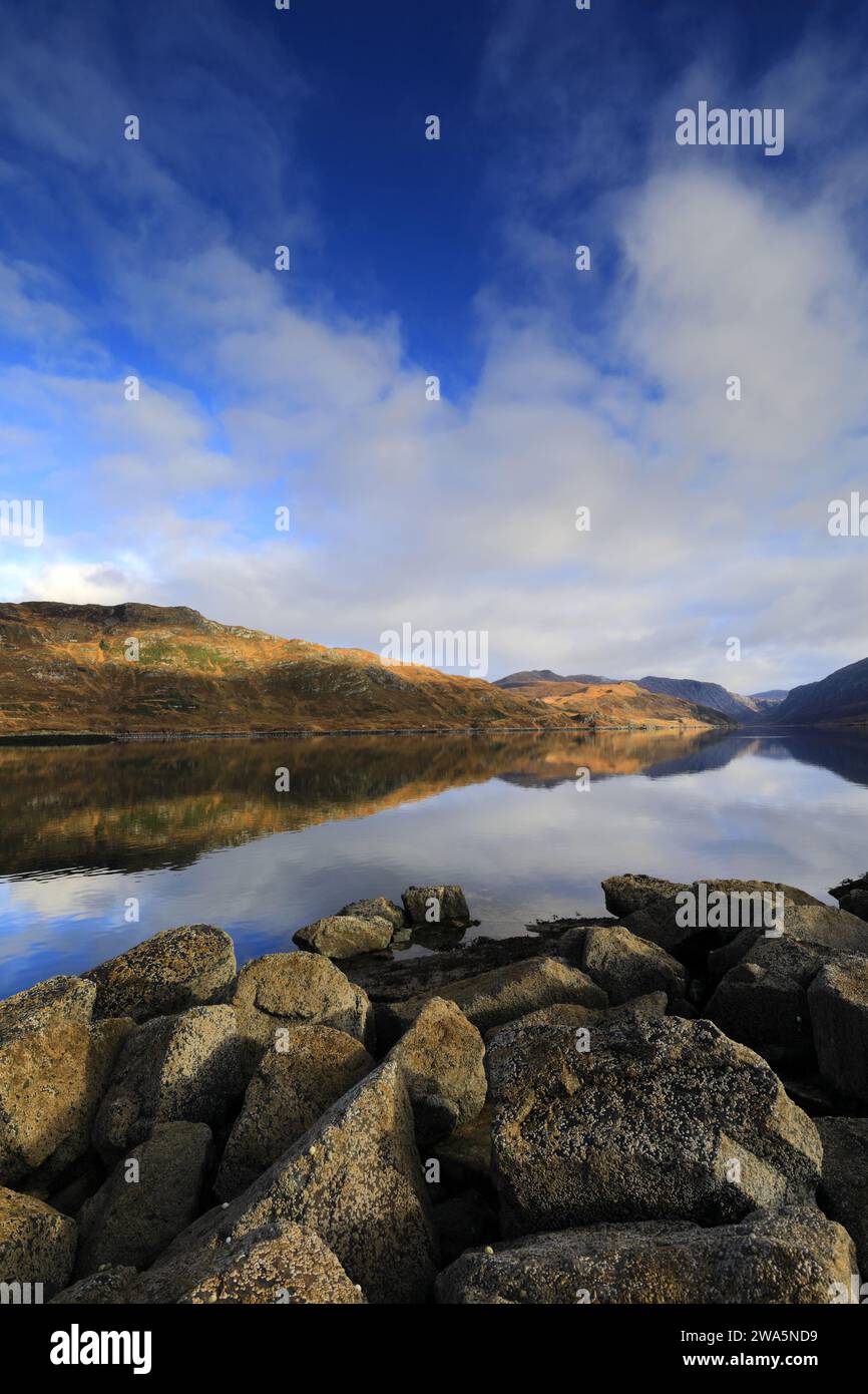 Mountain reflections in Loch Gleann Dubh, Kylesku village, Sutherland ...