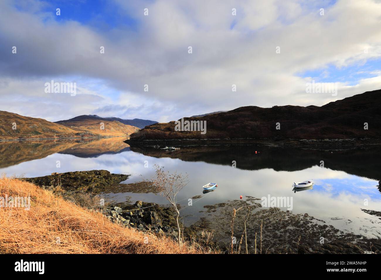 Mountain reflections in Loch Gleann Dubh, Kylesku village, Sutherland ...