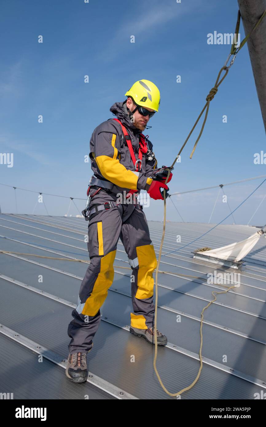 Caucasian worker on rooftop preparing hi-res stock photography and ...