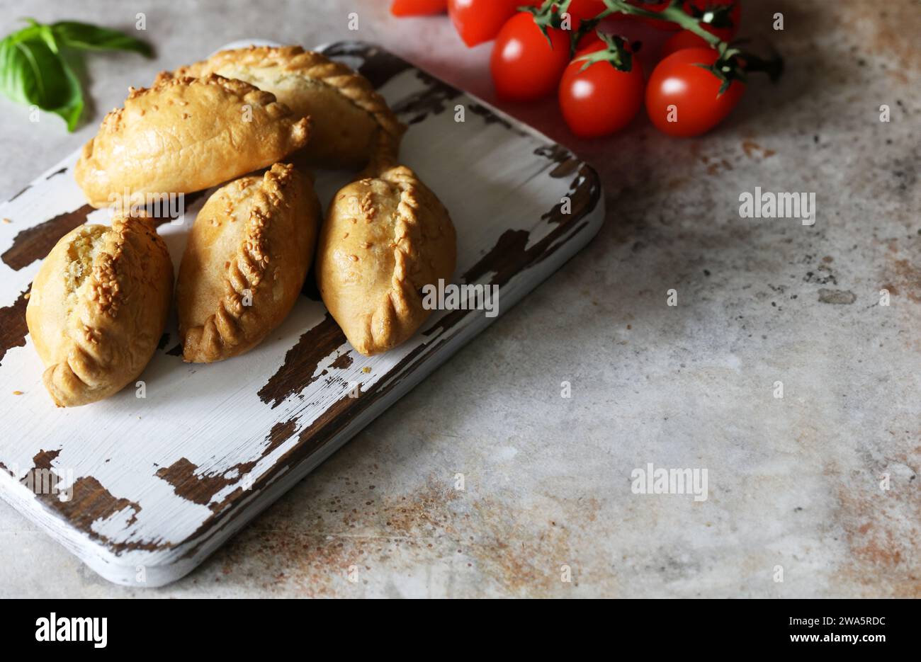 homemade mini pies with filling for snacks Stock Photo - Alamy