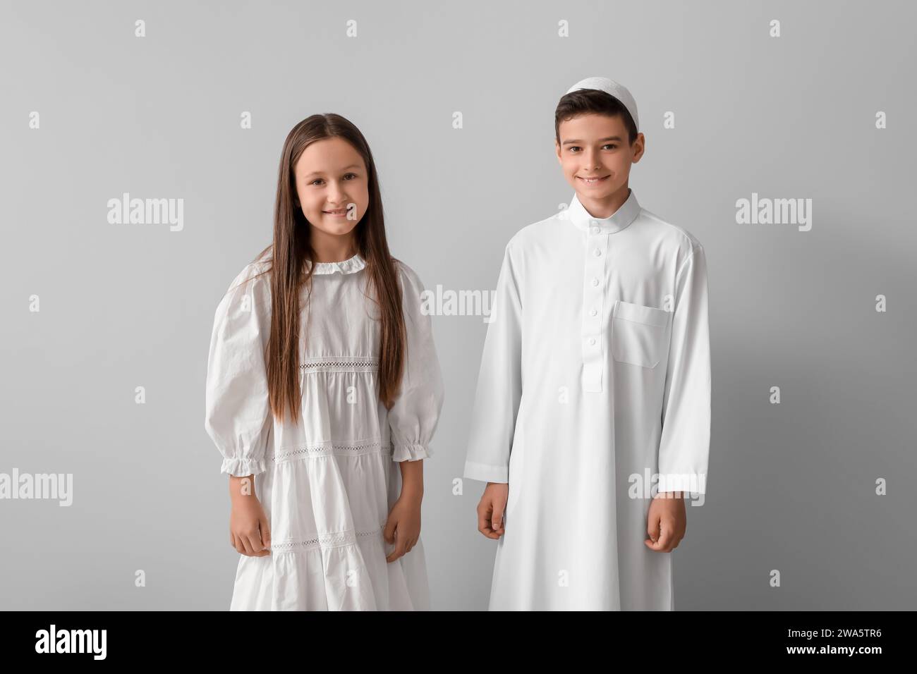 Little Muslim children on light background Stock Photo - Alamy