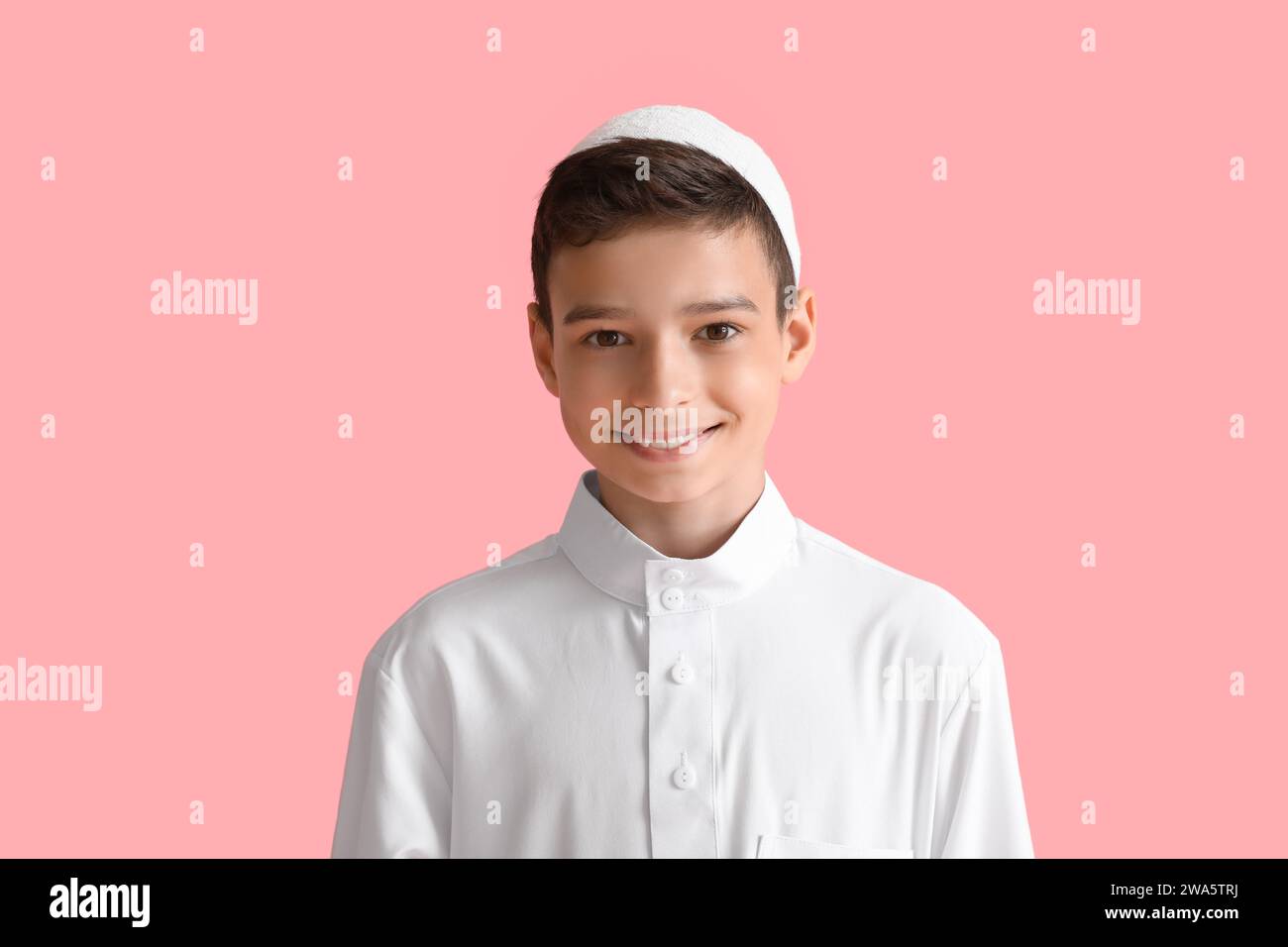 Little Muslim boy on pink background Stock Photo - Alamy