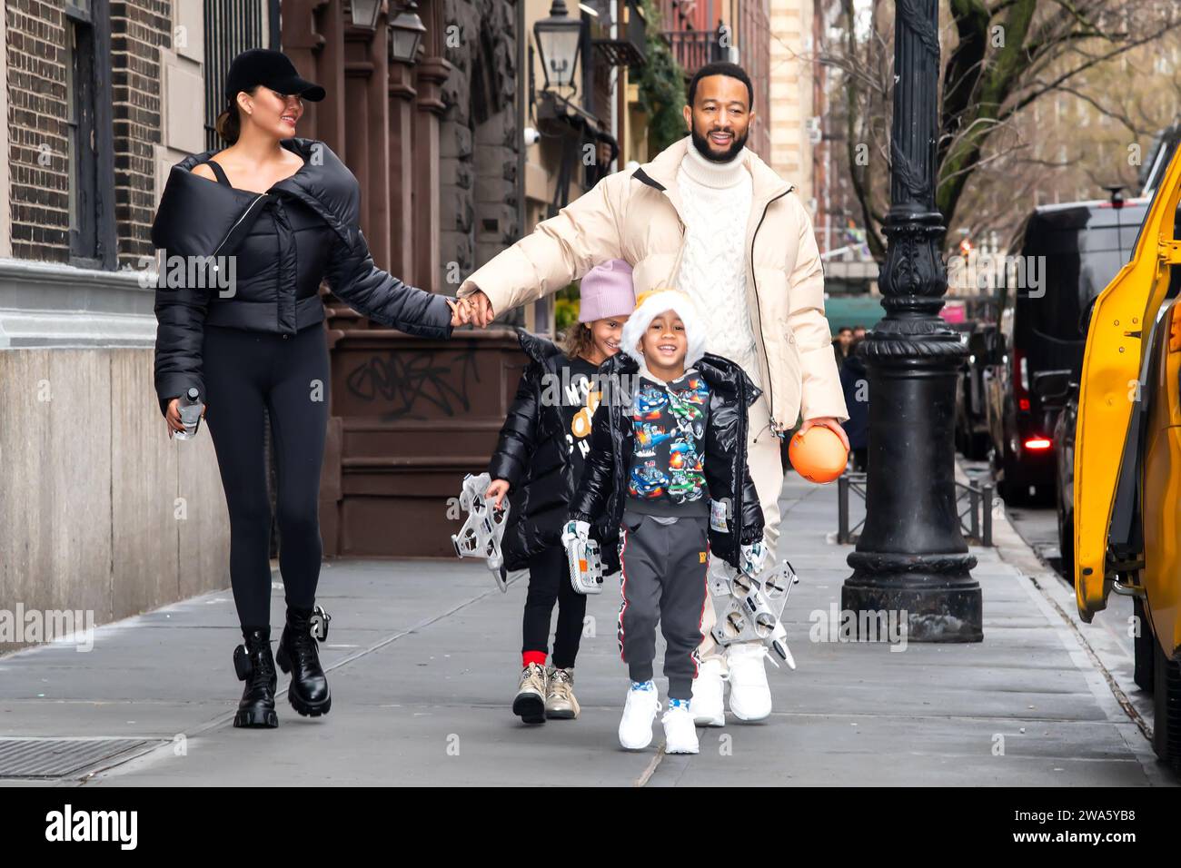 Chrissy Teigen and John Legend out for a stroll with their kids ...