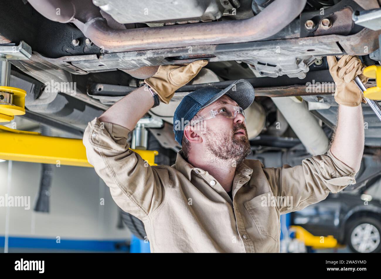 Mechanic under car bonnet hi-res stock photography and images - Alamy