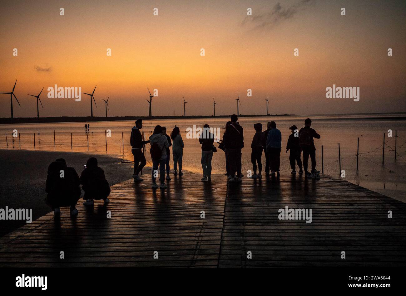 Taichung, China. 02nd Jan, 2024. Visitors enjoy the serene sunset at ...
