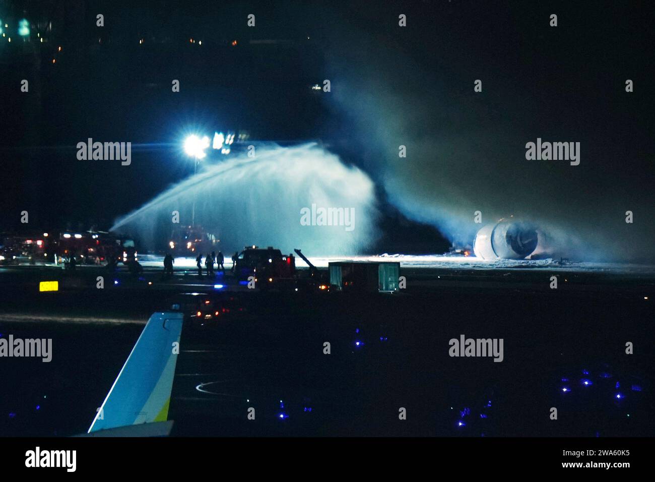 A Japan Airlines flight 156 catches fire on the C runway at Haneda ...