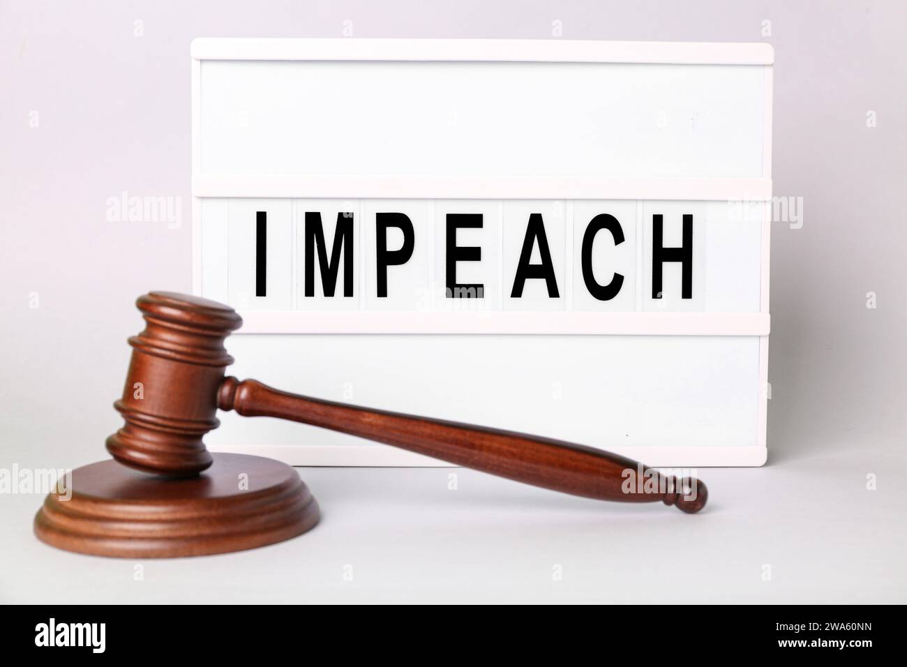 Judge gavel and board with word IMPEACH on white background Stock Photo ...