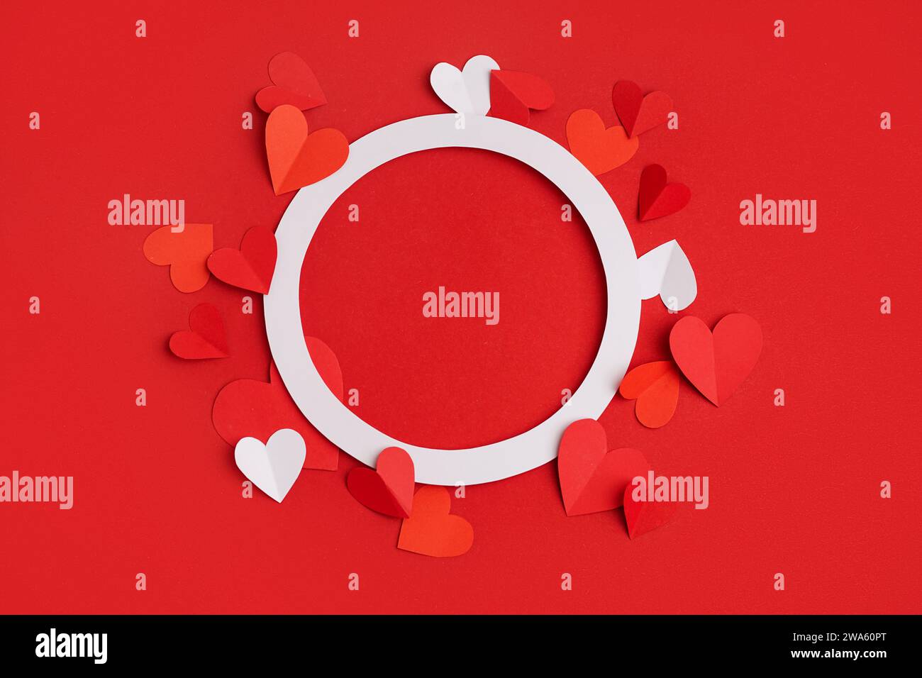 Frame made of paper circle and hearts on red background. Valentine's ...