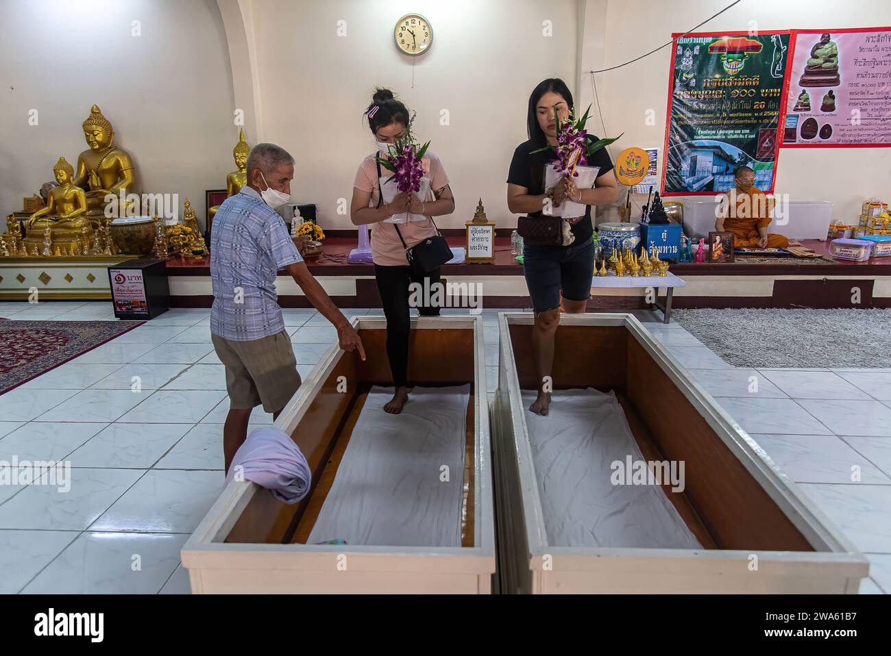Bangkok, Thailand. 02nd Jan, 2024. Buddhist devotees pray before laying ...