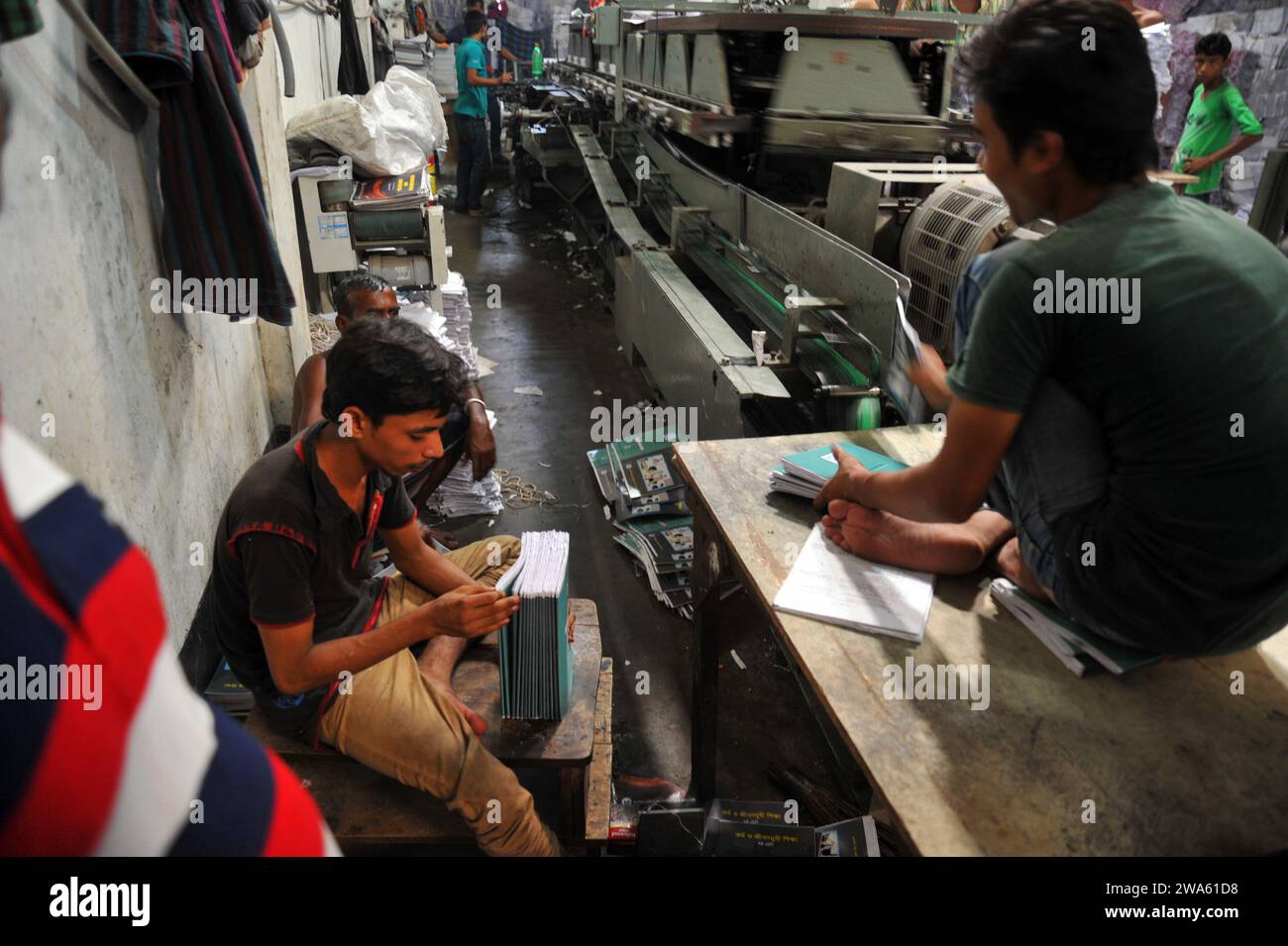 Bangladeshi worker works in a book binding factory in Dhaka City in ...