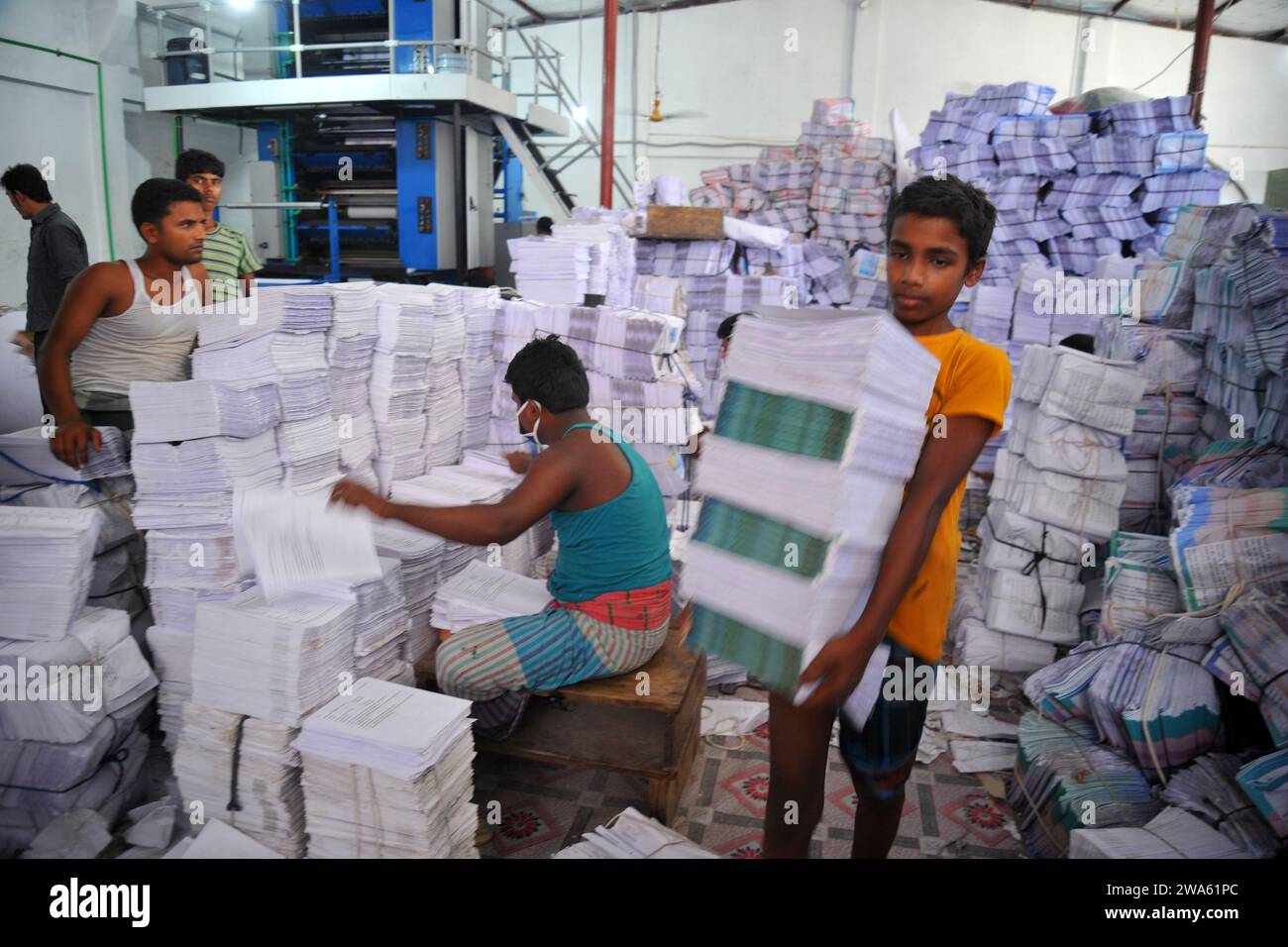 Bangladeshi worker works in a book binding factory in Dhaka City in ...