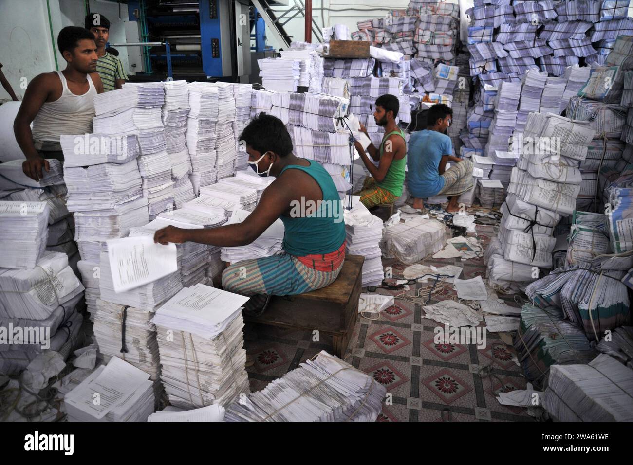 Bangladeshi worker works in a book binding factory in Dhaka City in ...