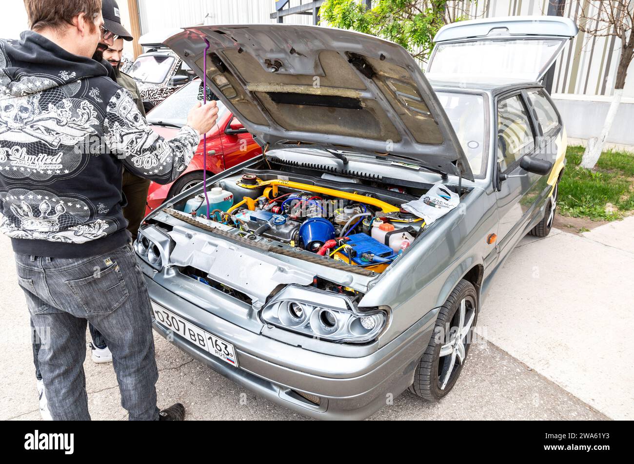 Samara, Russia - May 14, 2023: Engine under the hood of a tuning Lada ...