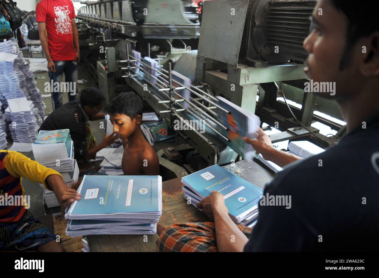 Bangladeshi worker works in a book binding factory in Dhaka City in ...