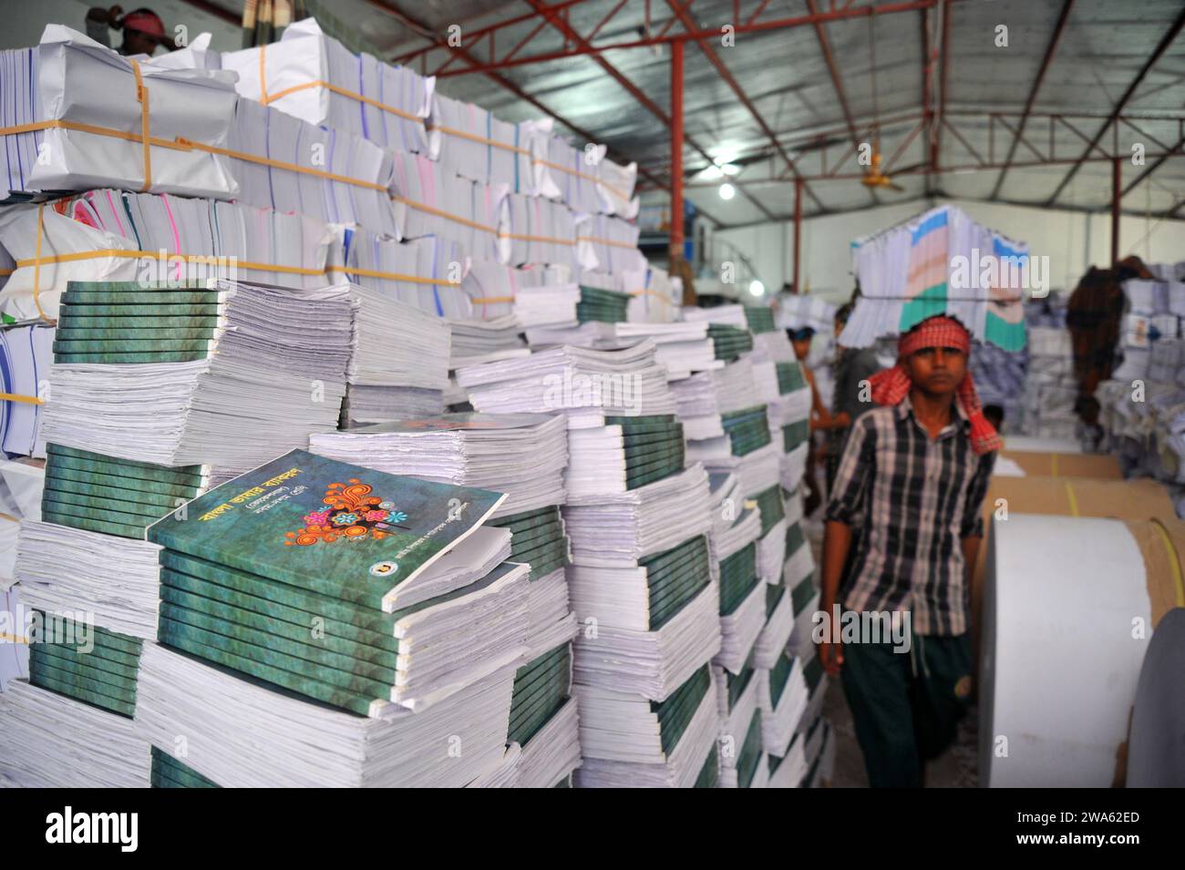 Bangladeshi worker works in a book binding factory in Dhaka City in ...