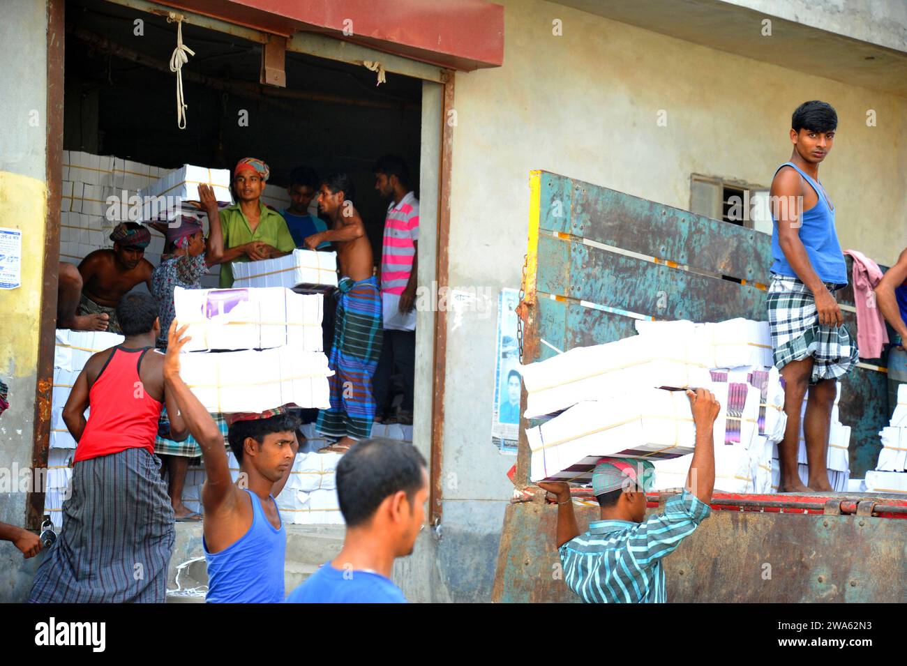 Bangladeshi worker works in a book binding factory in Dhaka City in ...