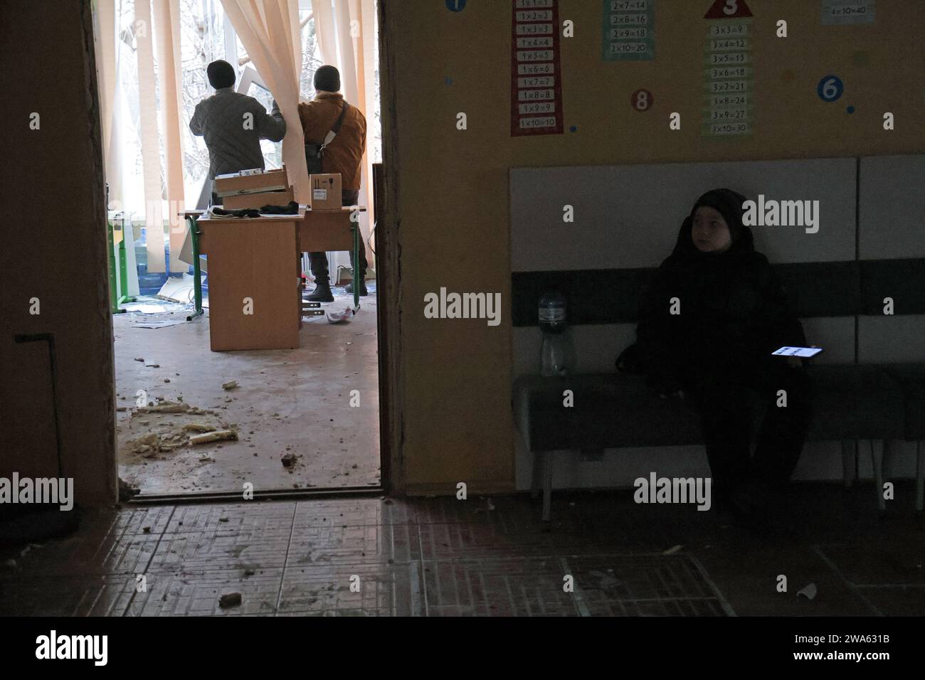 Non Exclusive: KYIV, UKRAINE - JANUARY 2, 2024 - A boy sits on the ...