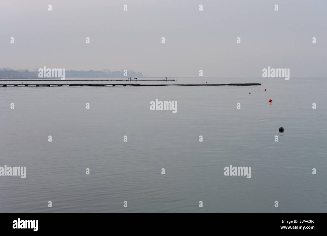 Grado sea during a winter day with a thick fog which makes the ...