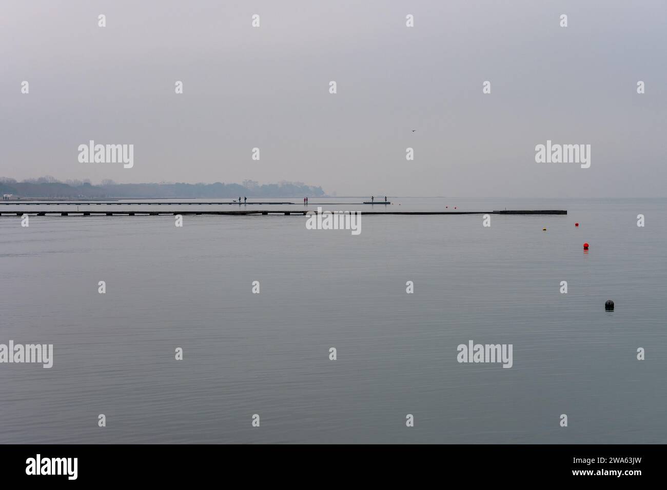 Grado sea during a winter day with a thick fog which makes the ...
