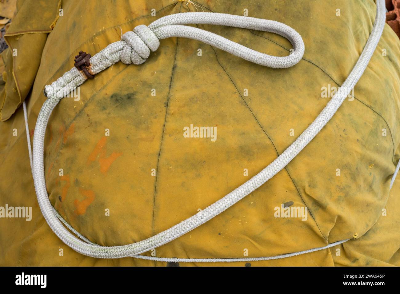 Close-up of a rope with a knot for quick attachment on the port of ...