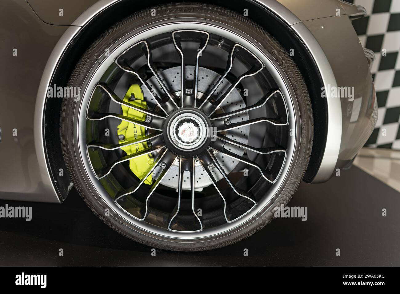 Michelin car tire in combination with a Porsche alloy wheel. The ...