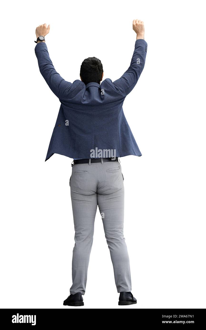 A man in a jacket on a White background raised his hands up. Back view ...