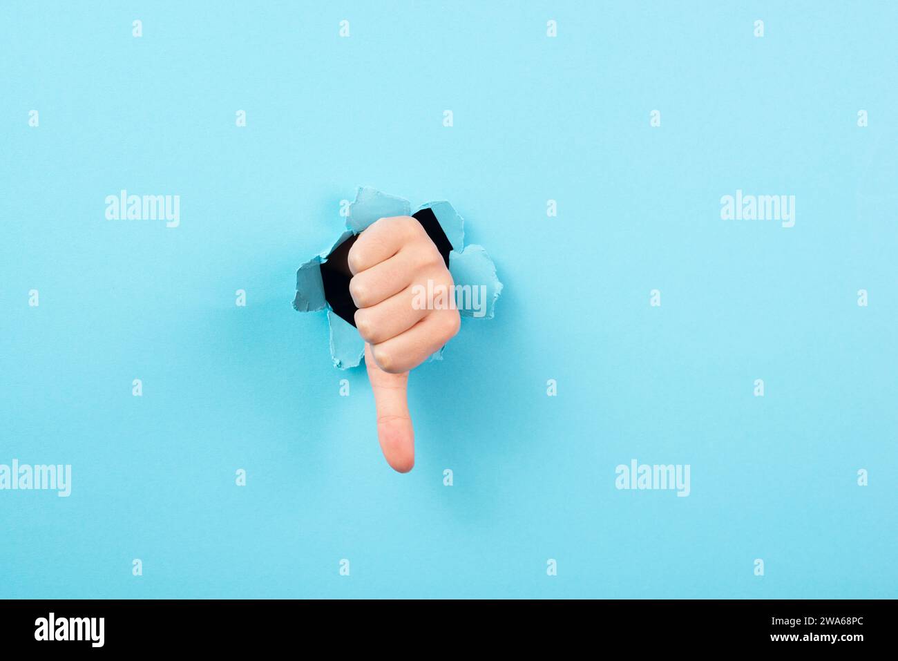 Thumb down, negative hand gesture, dislike or disagree, expression of ...