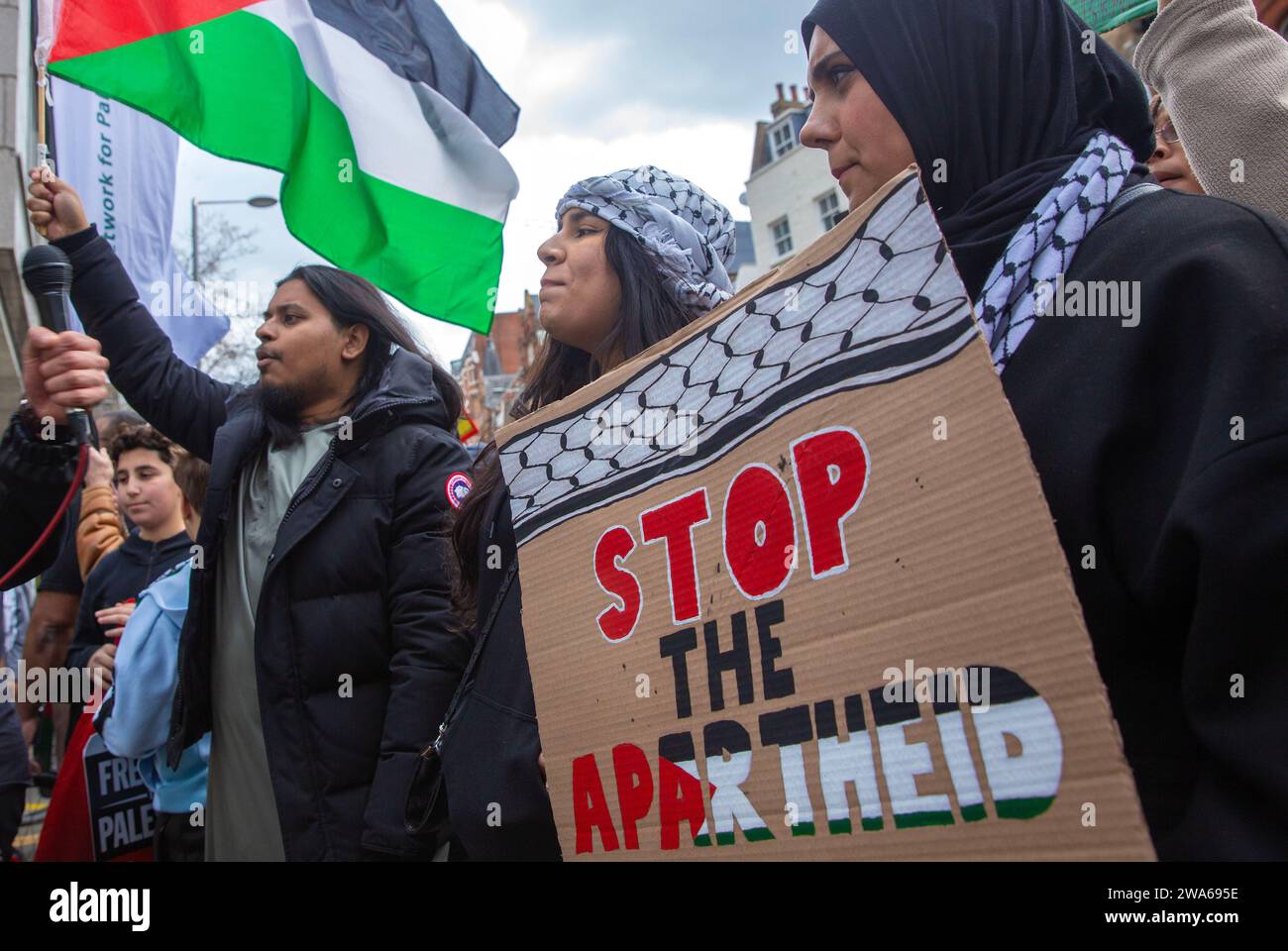 Pro-Palestinian protesters gather with flags and placards during a ...