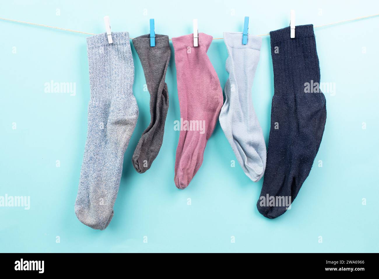 Lost socks hanging on a clothes line with clothespin, missing sock ...