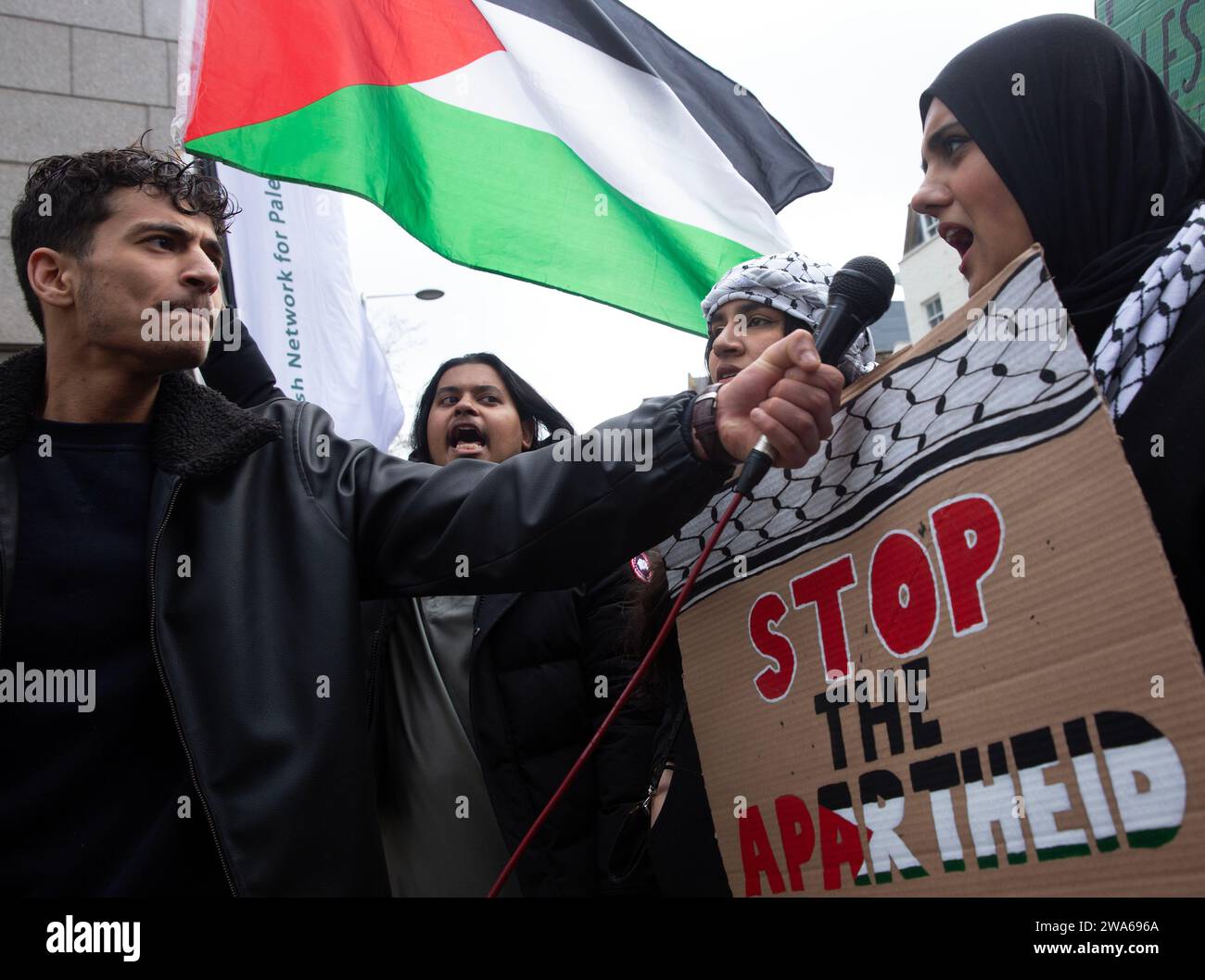 Pro-Palestinian protesters gather with flags and placards during a ...