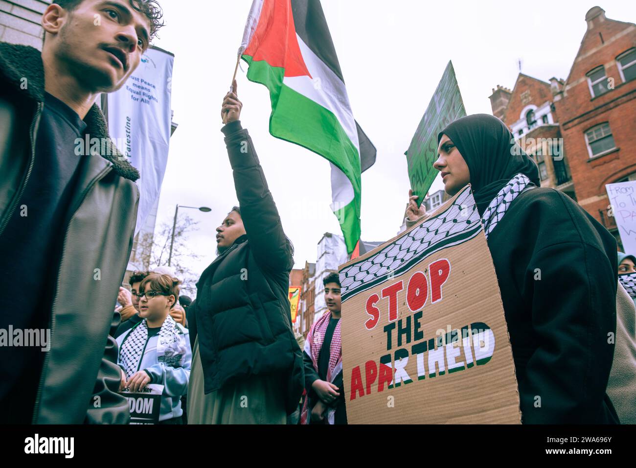 Pro-Palestinian protesters gather with flags and placards during a ...